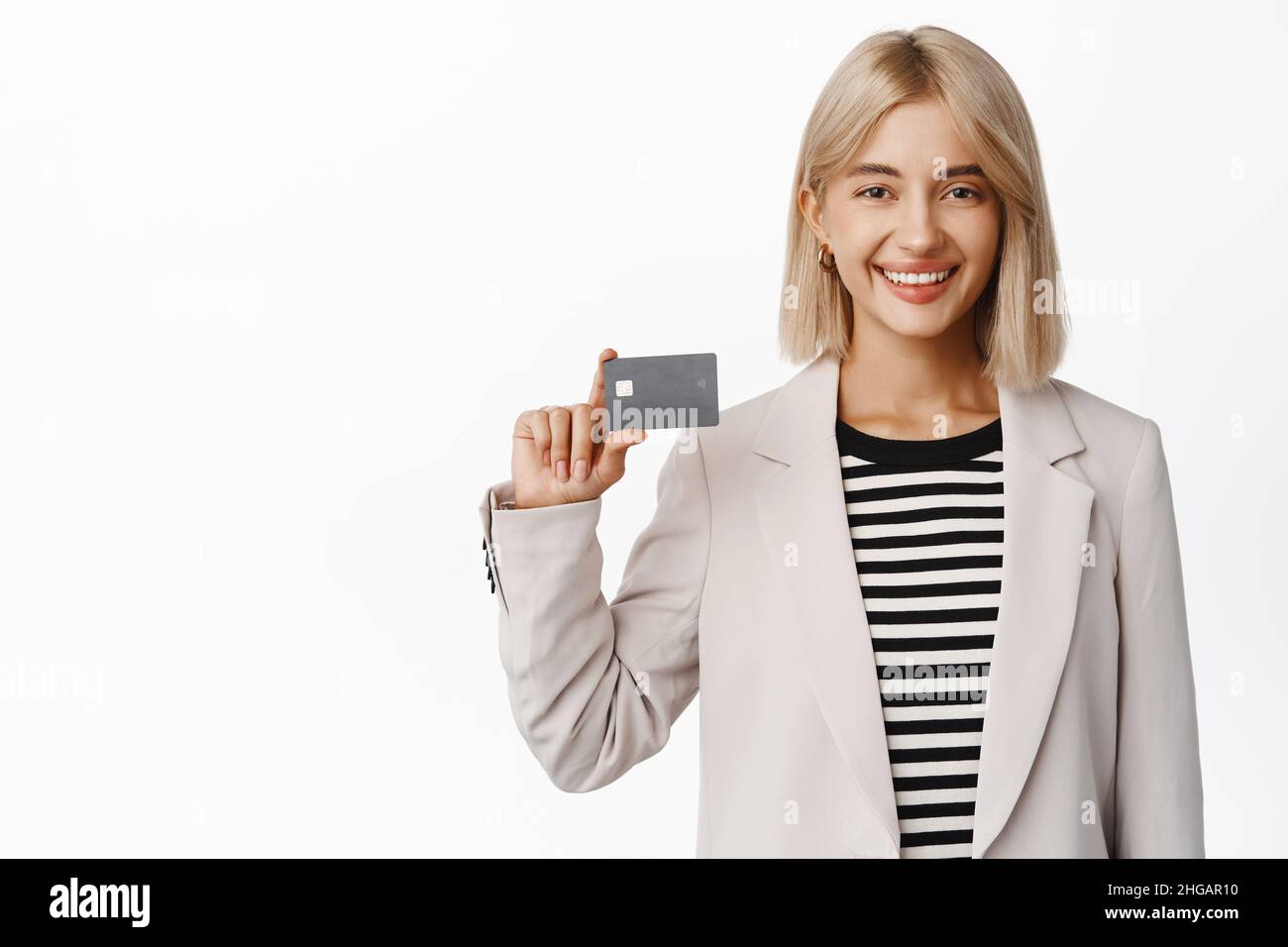 Image of smiling saleswoman showing credit card, bank clerk ...