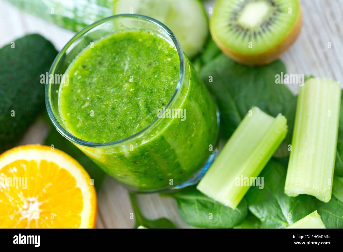 fresh green smoothie on wooden surface Stock Photo - Alamy