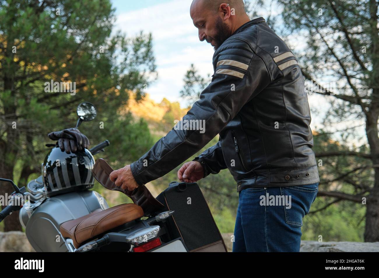 Man carrying motorcycle helmet hi-res stock photography and images - Alamy