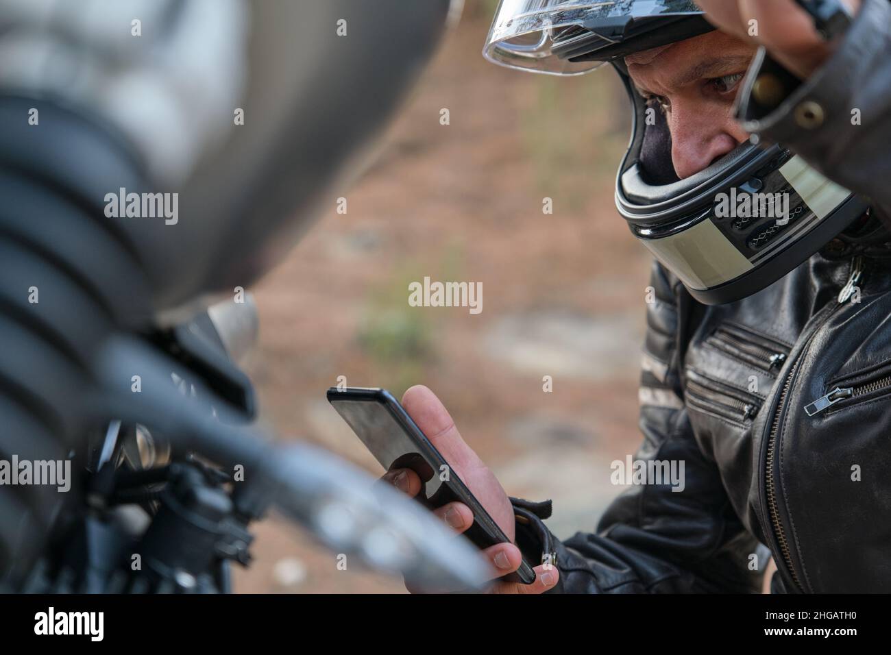 Talking to motorcyclist hi-res stock photography and images - Alamy