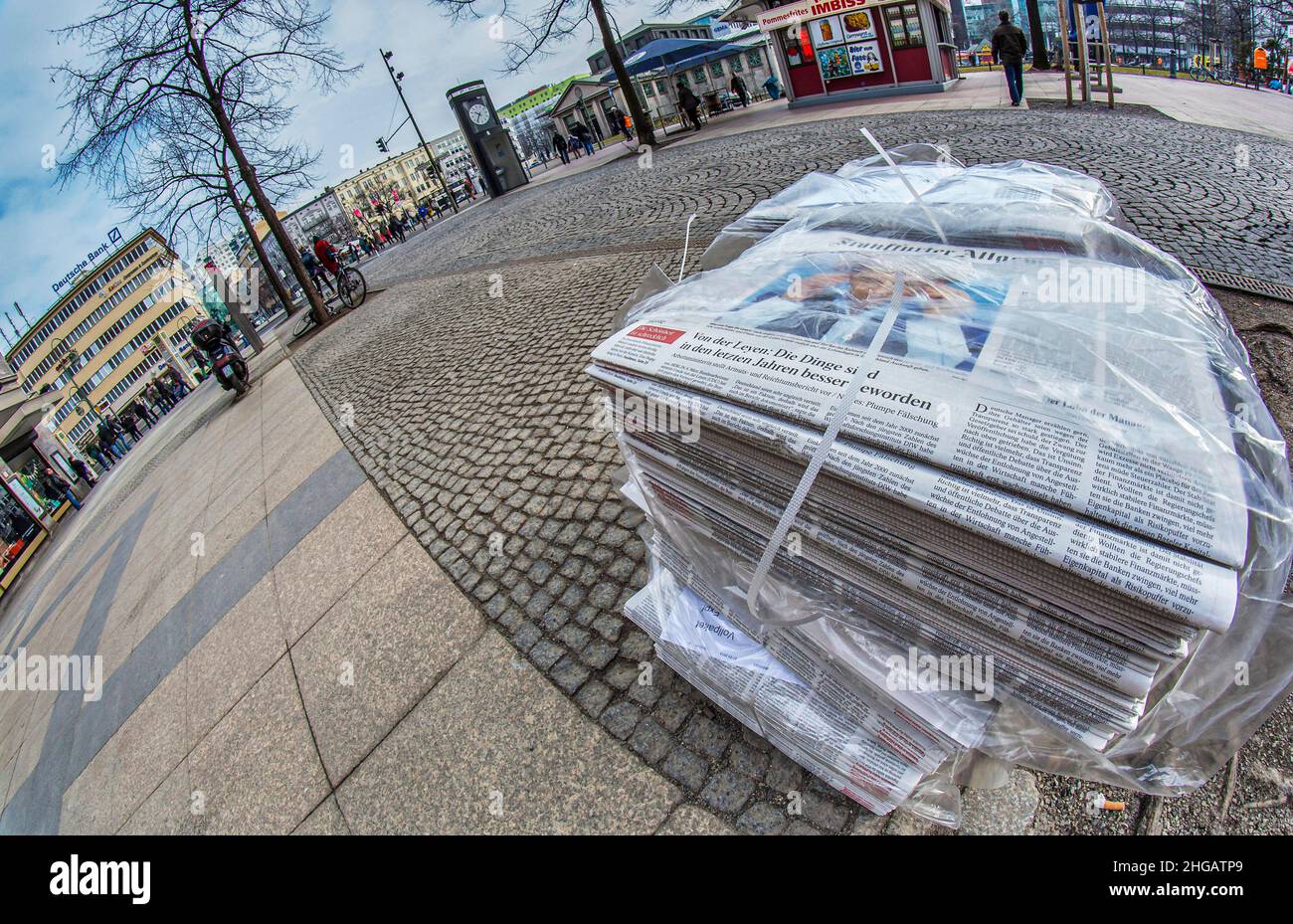 Piles of daily newspapers on the pavement, Berlin, Germany Stock Photo ...