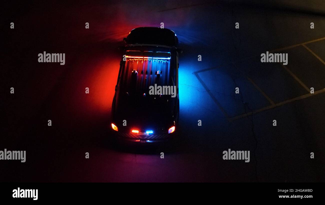Police SUV at night with lights on Stock Photo - Alamy