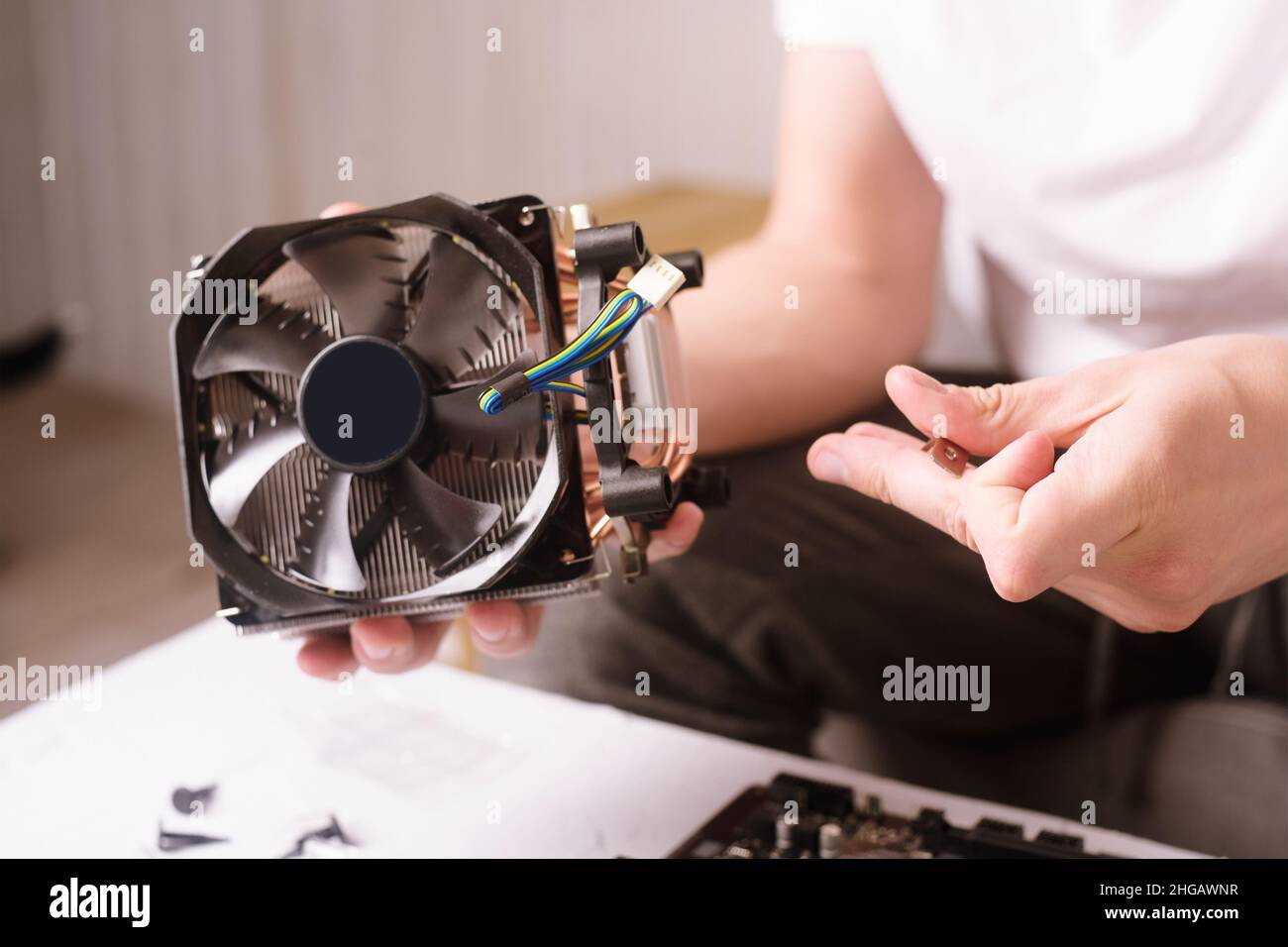 Computer technician installs cooling system of computer. Engineer ...