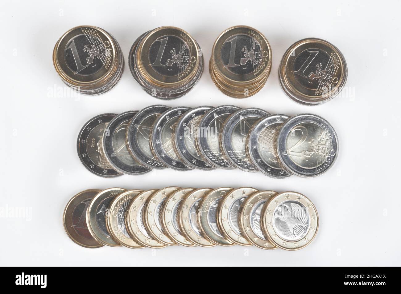 Stack of 1 and 2 euro coins, studio shot Stock Photo - Alamy