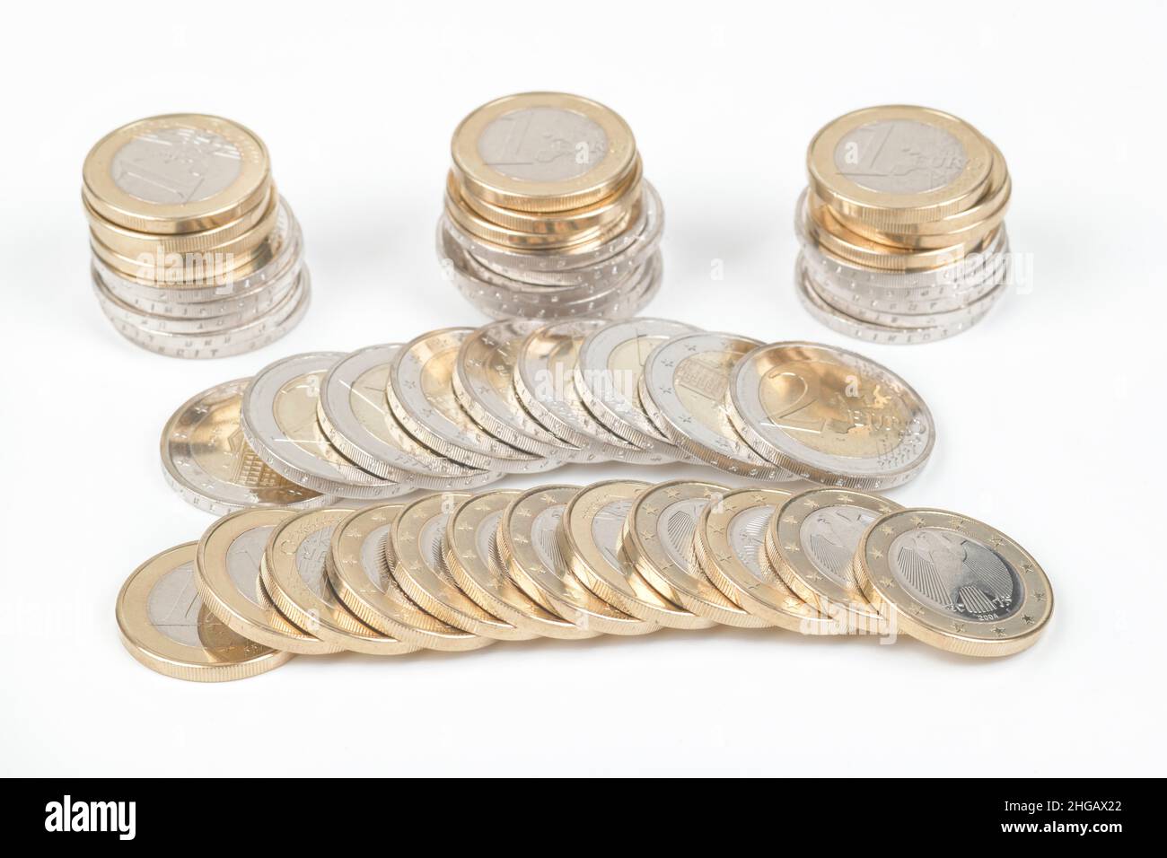 Stack of 1 and 2 euro coins, studio shot Stock Photo - Alamy