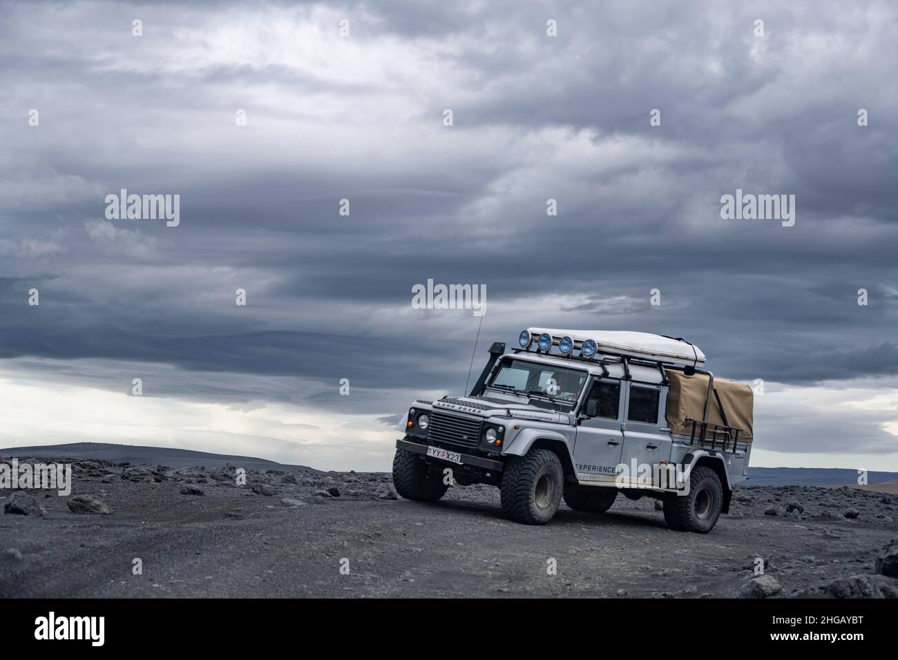 Land Rover 4x4 car on gravel road, barren landscape, Icelandic ...