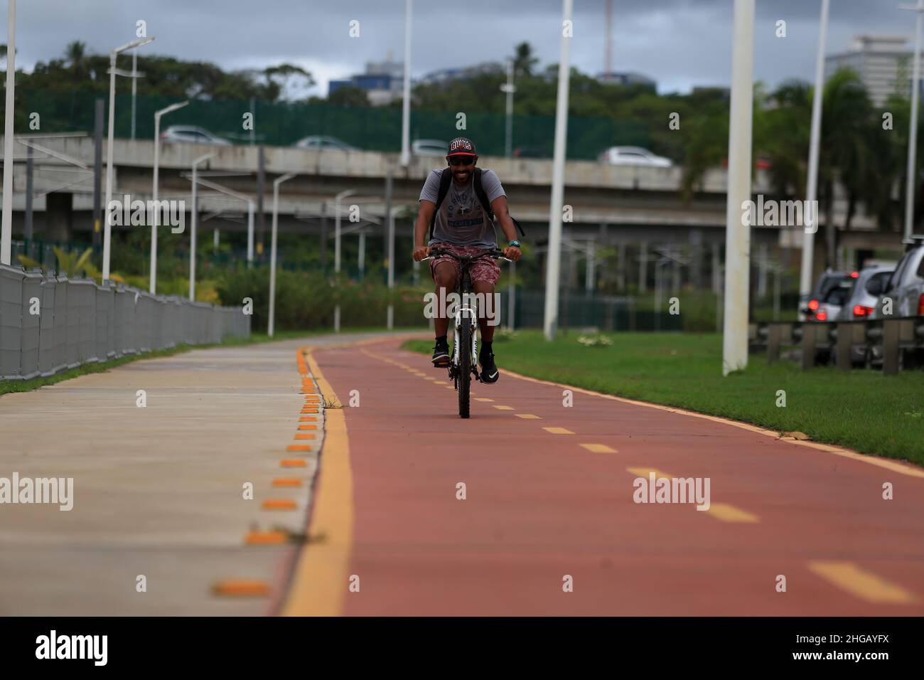 salvador, bahia, brazil - april 2, 2019: Person riding a bicycle on a ...