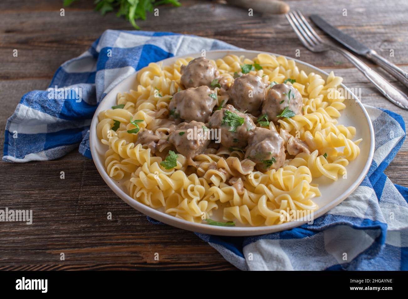 Pasta with meatballs and sauce. Traditional swedish köttbullar with ...