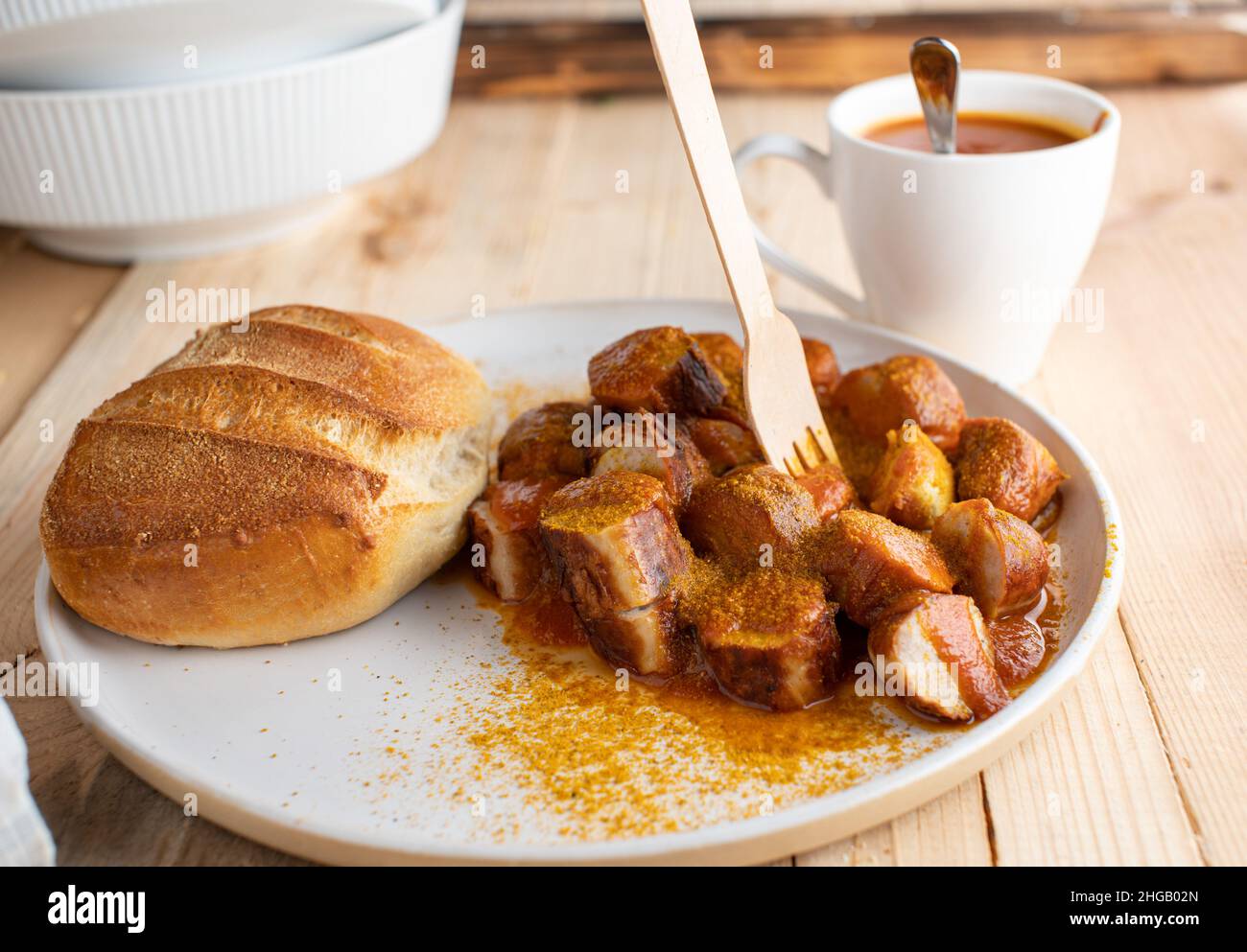 Traditional german currywurst with bun Stock Photo - Alamy