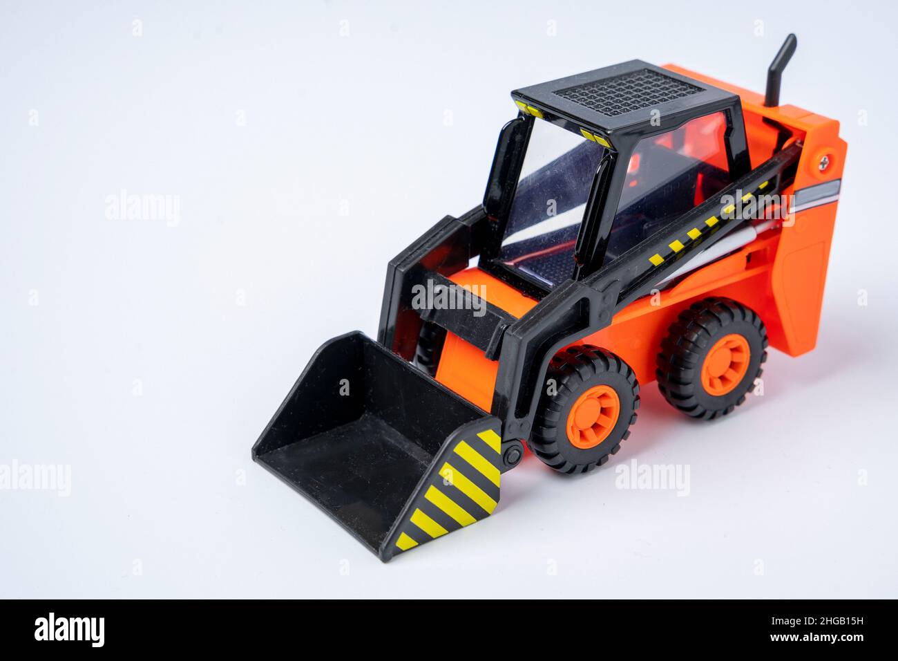 Orange Toy Loader on white background, Mini Loader, Toy Industrial Car ...