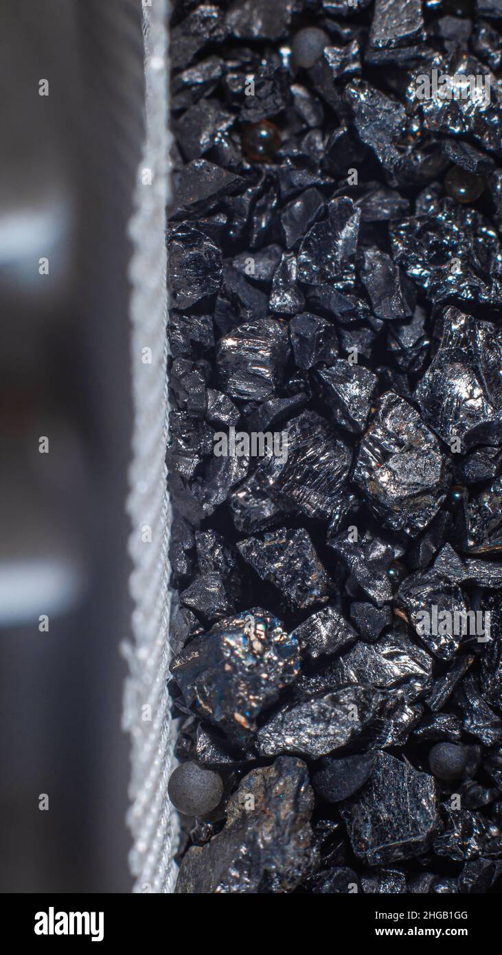 Vertical photo of a grid retaining activated carbon in a filter Stock ...
