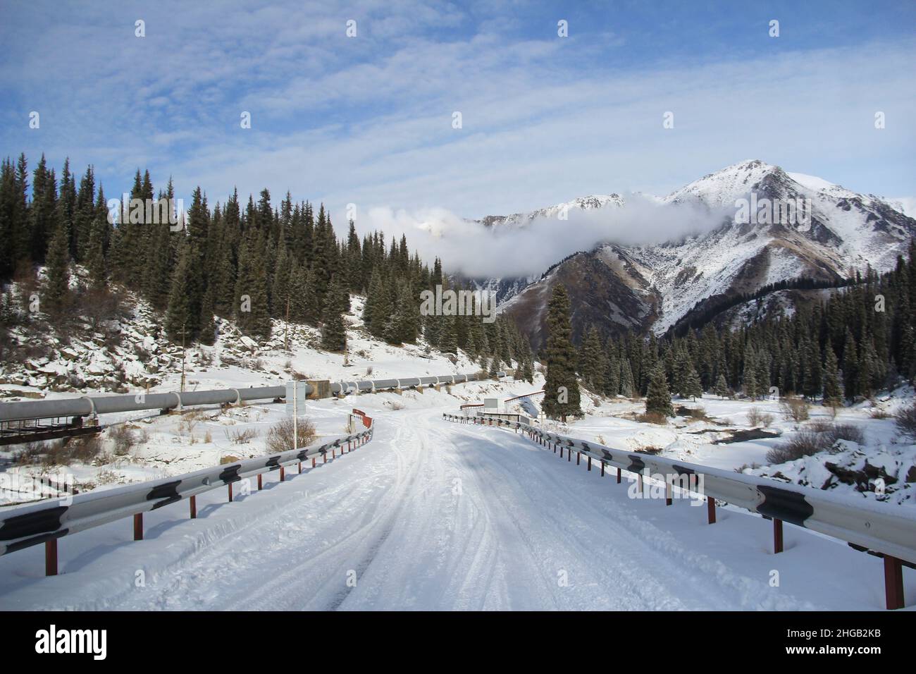Snowy road in alpine gorge hi-res stock photography and images - Alamy