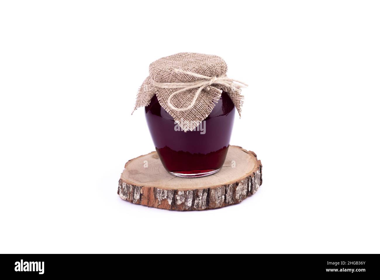 Glass jar of jam on wooden stands isolated on white background Stock ...