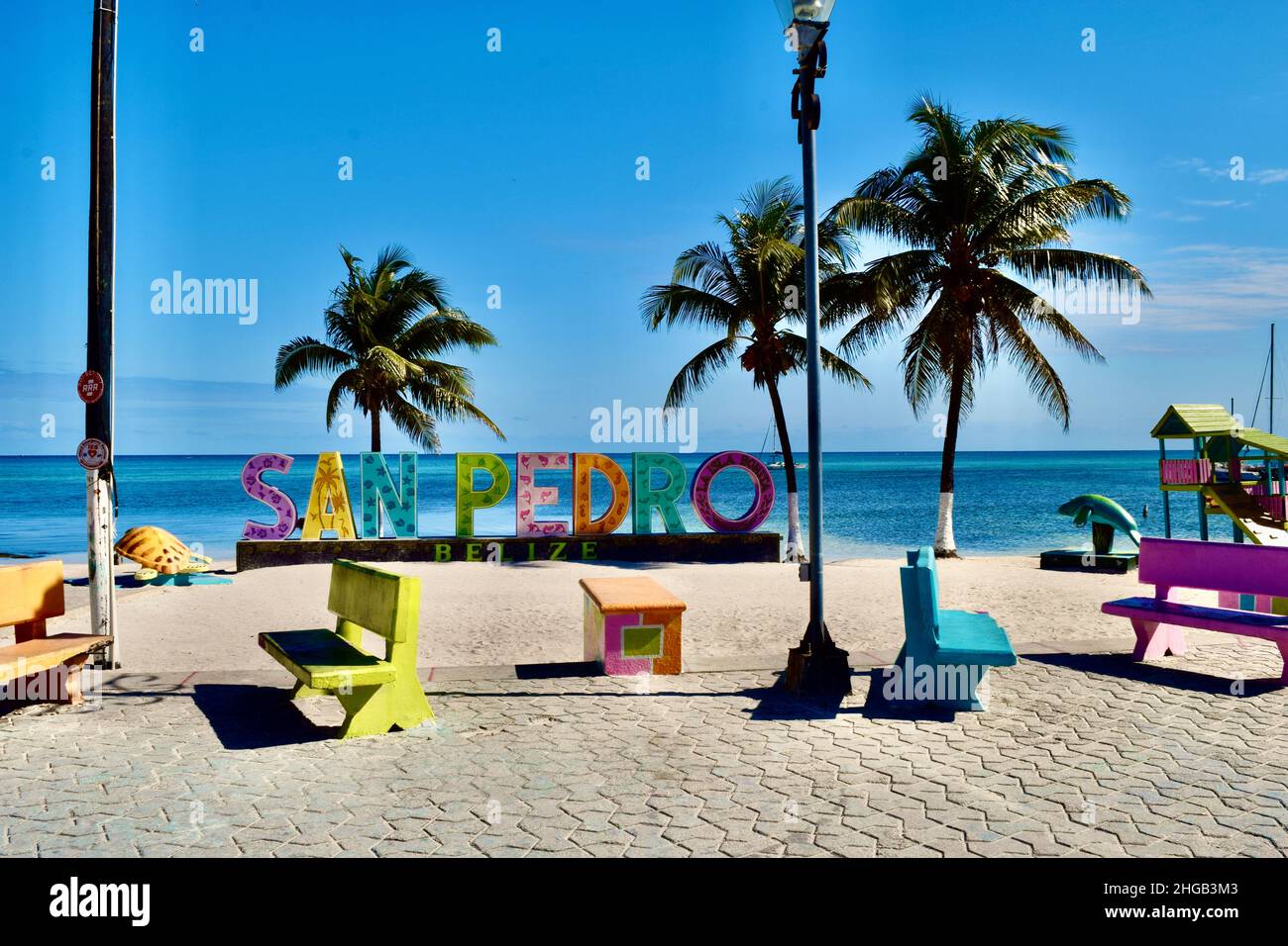 Colorful benches and the "San Pedro"sign in town square/central park ...