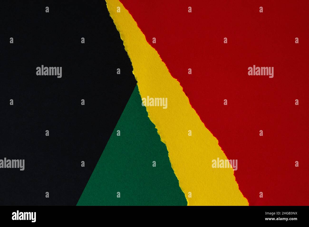 Abstract geometric black, red, yellow, green color paper background ...