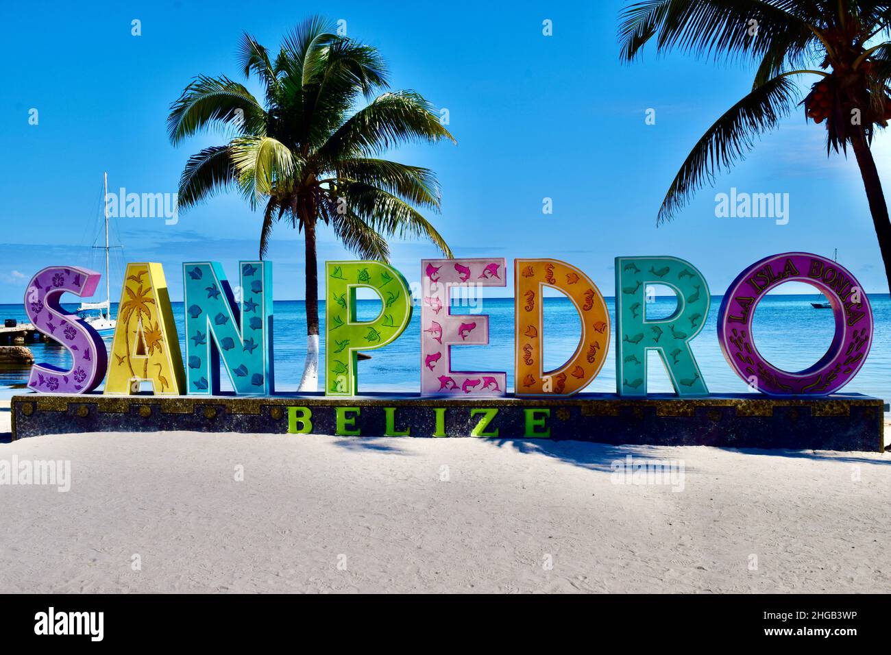 The "San Pedro"sign in the town square of San Pedro, Belize with two ...