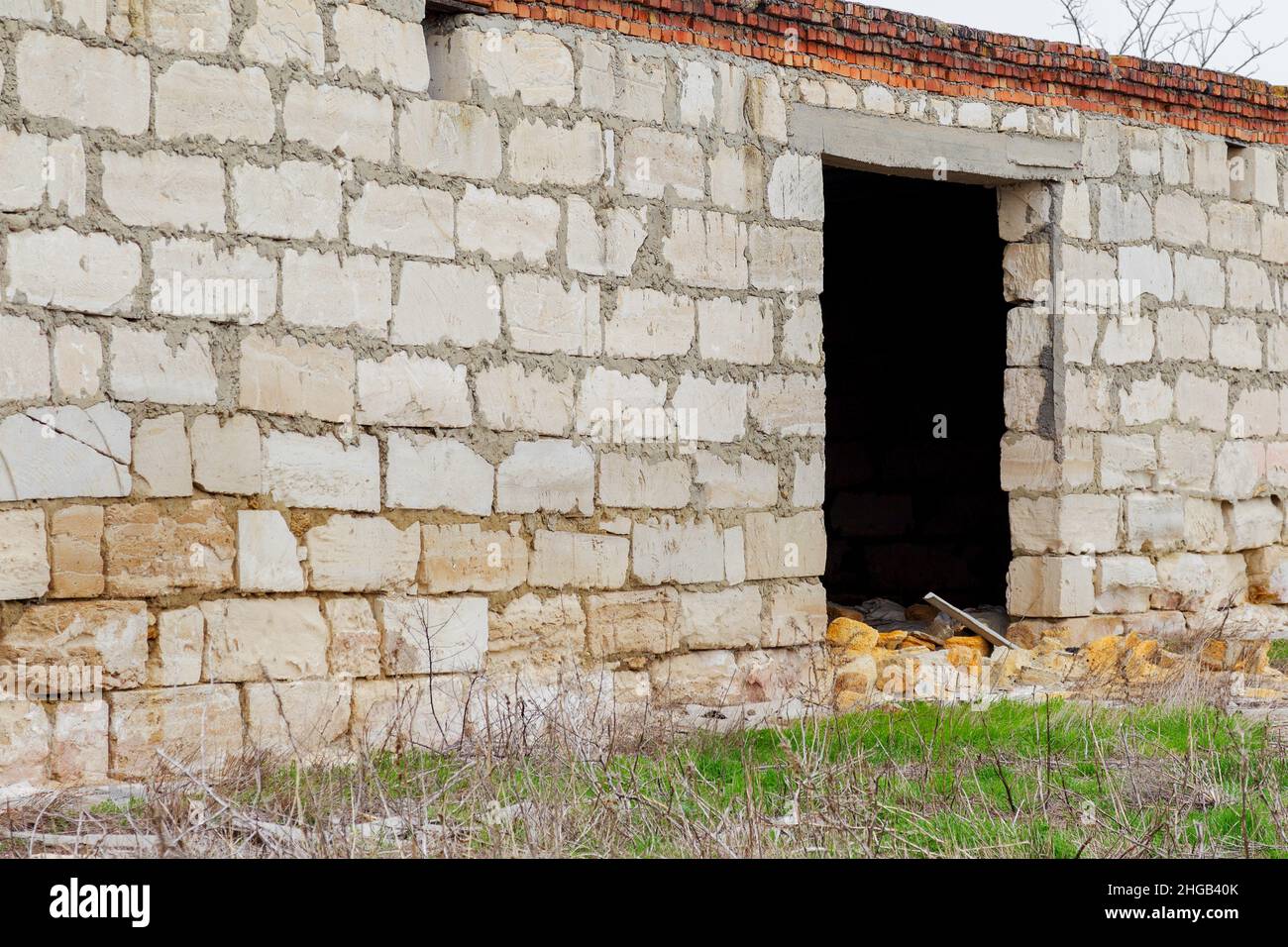 Old building falling apart with broken windows, walls covered with ...