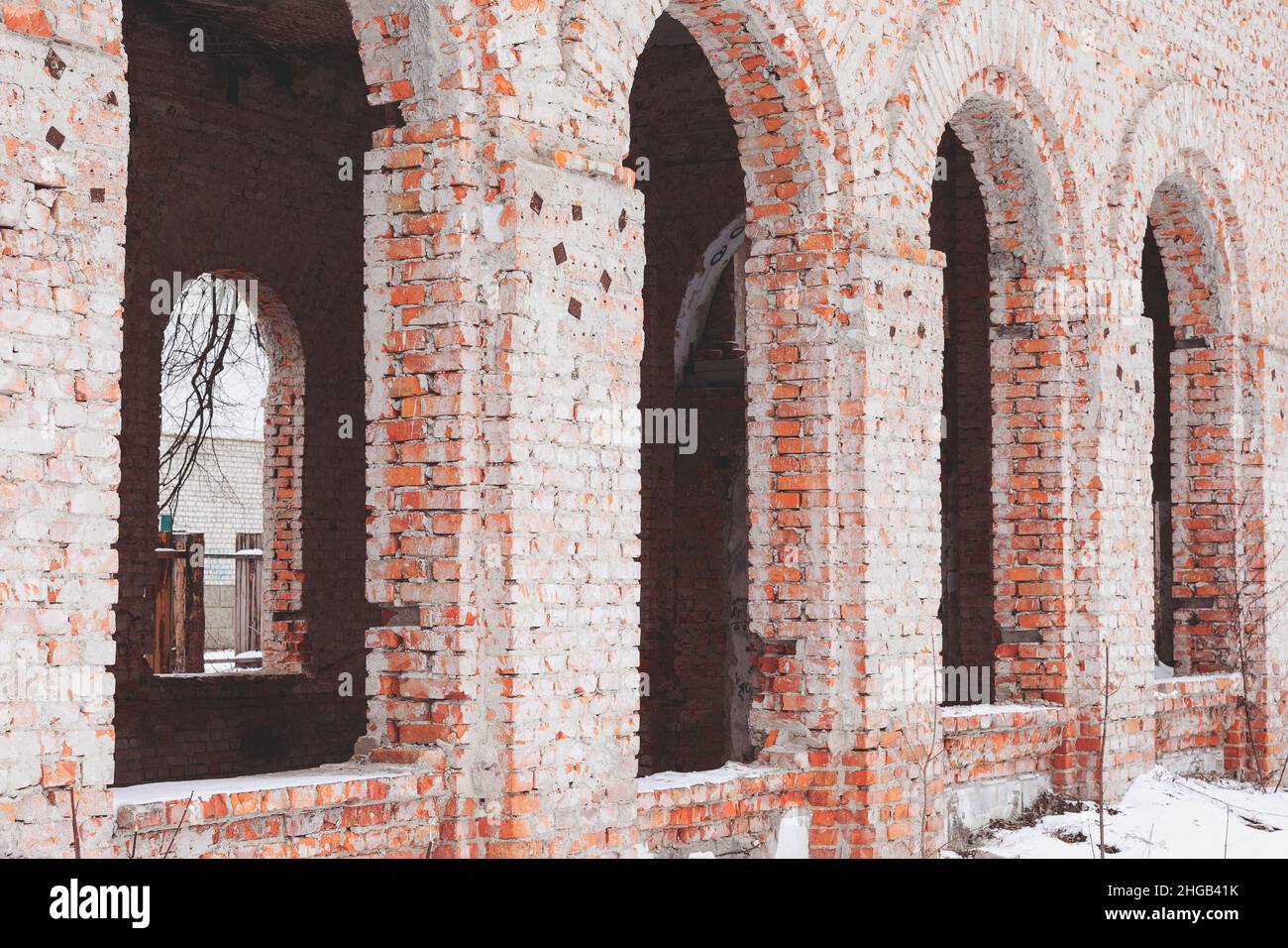 Old building falling apart with broken windows, walls covered with ...