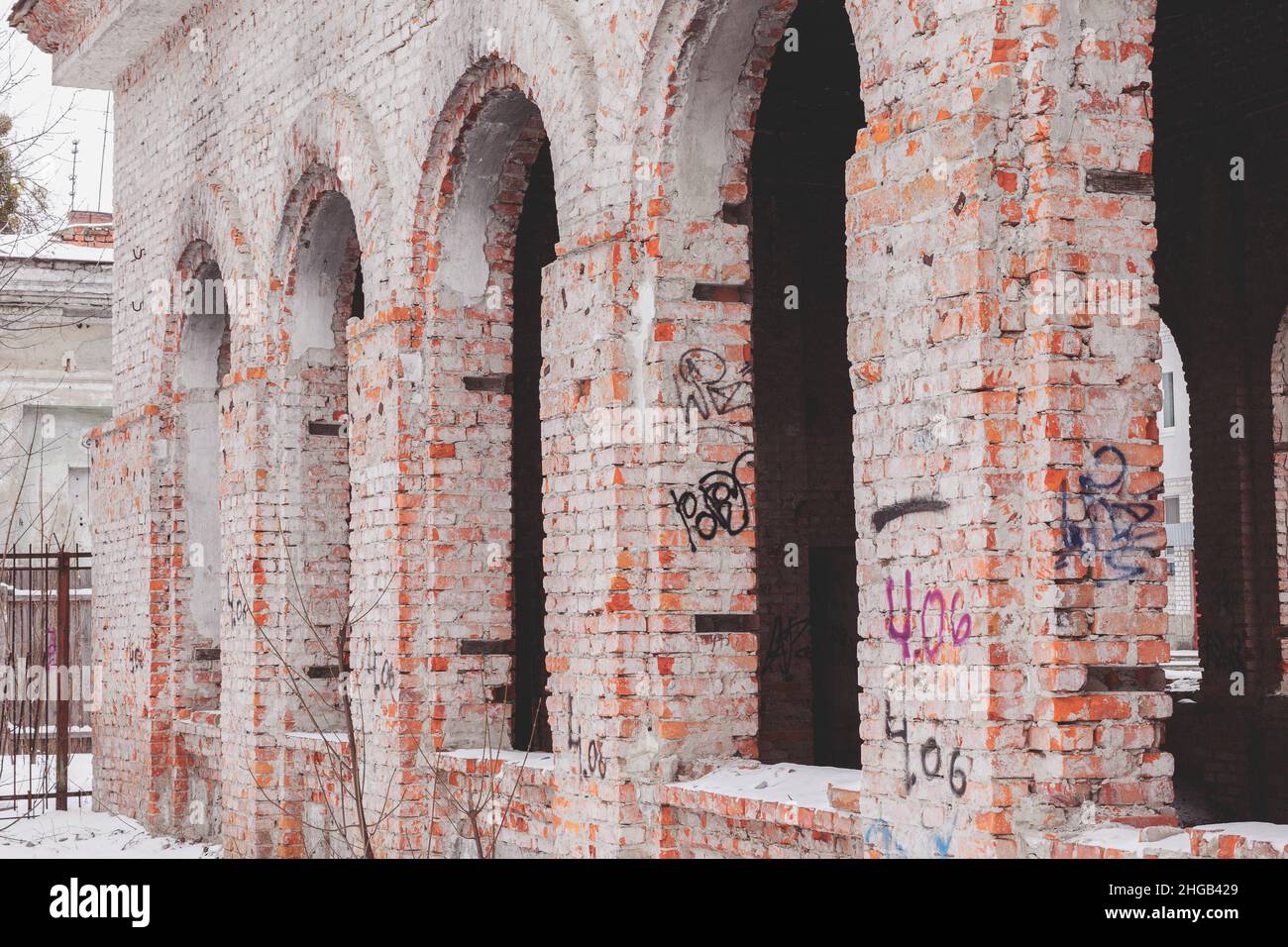 Old building falling apart with broken windows, walls covered with ...