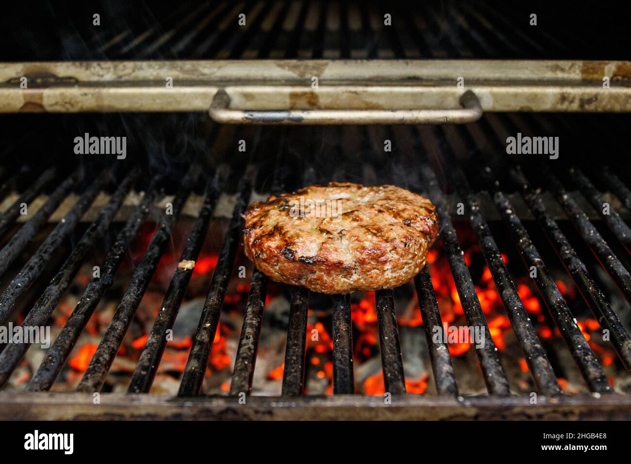 Beef burger for hamburger on barbecue flame grill Stock Photo - Alamy