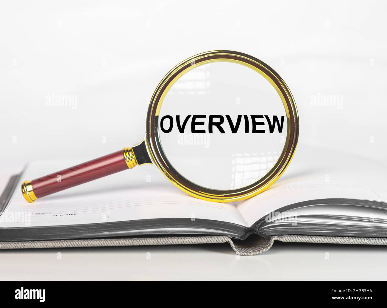 Overview word through magnifying lens. Recap and summary concept Stock ...