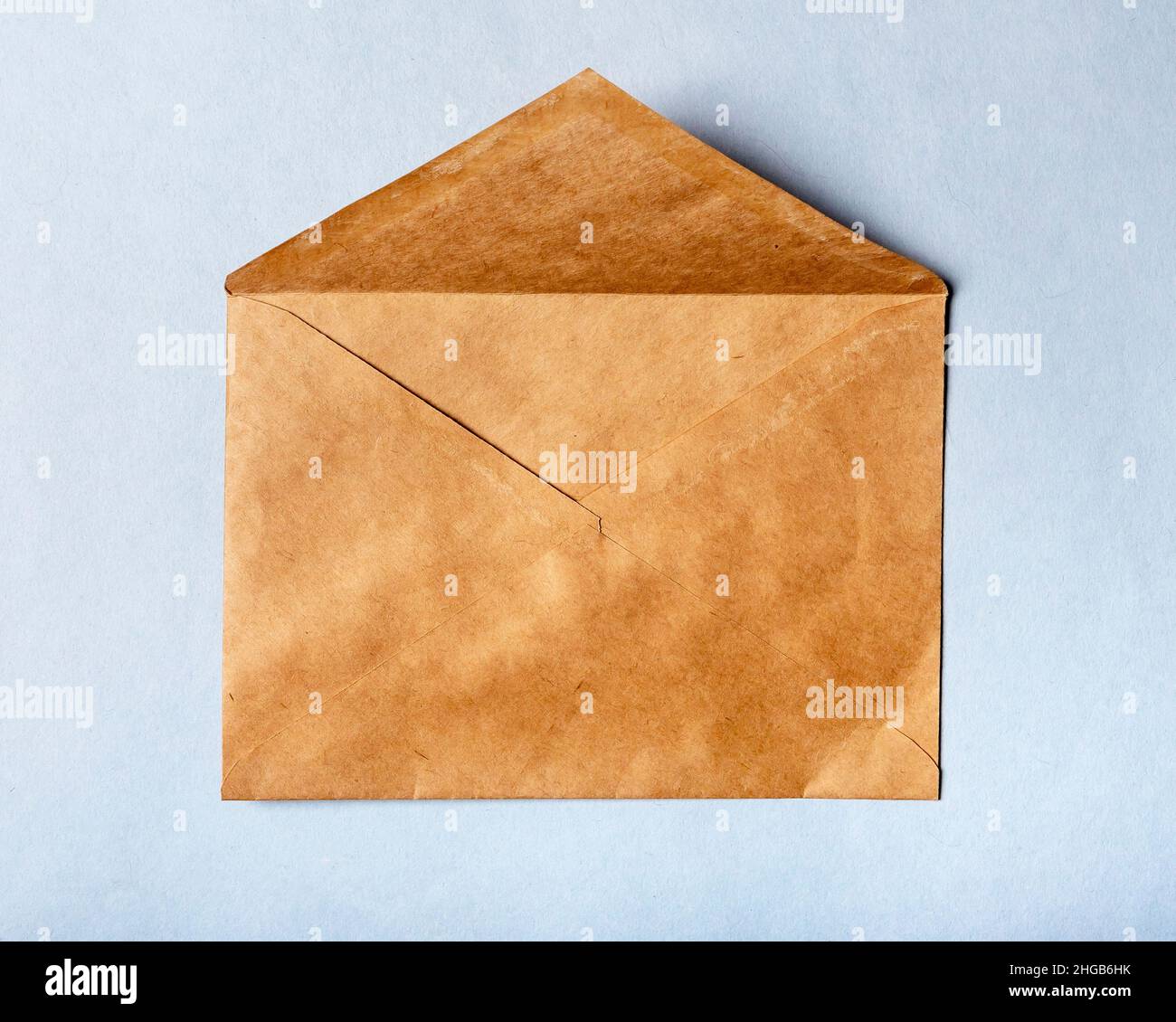 Open empty craft brown envelope. Paper mail concept Stock Photo - Alamy
