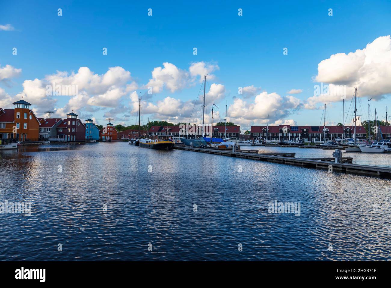 Groningen in Holland at sunrise. In the blue sky are white clouds over ...