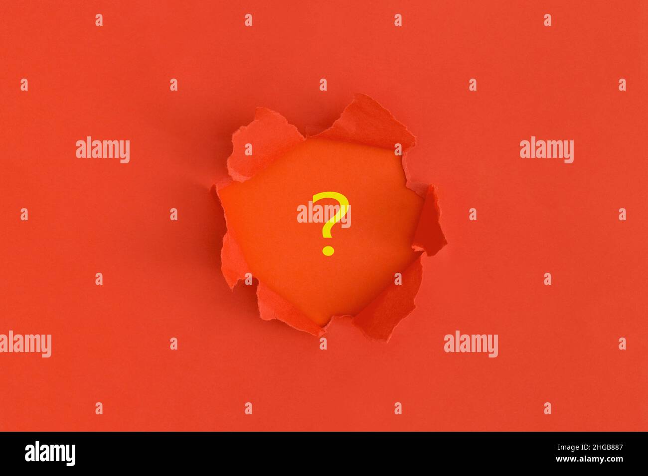 Red torn paper with space for text with red background. Question mark ...