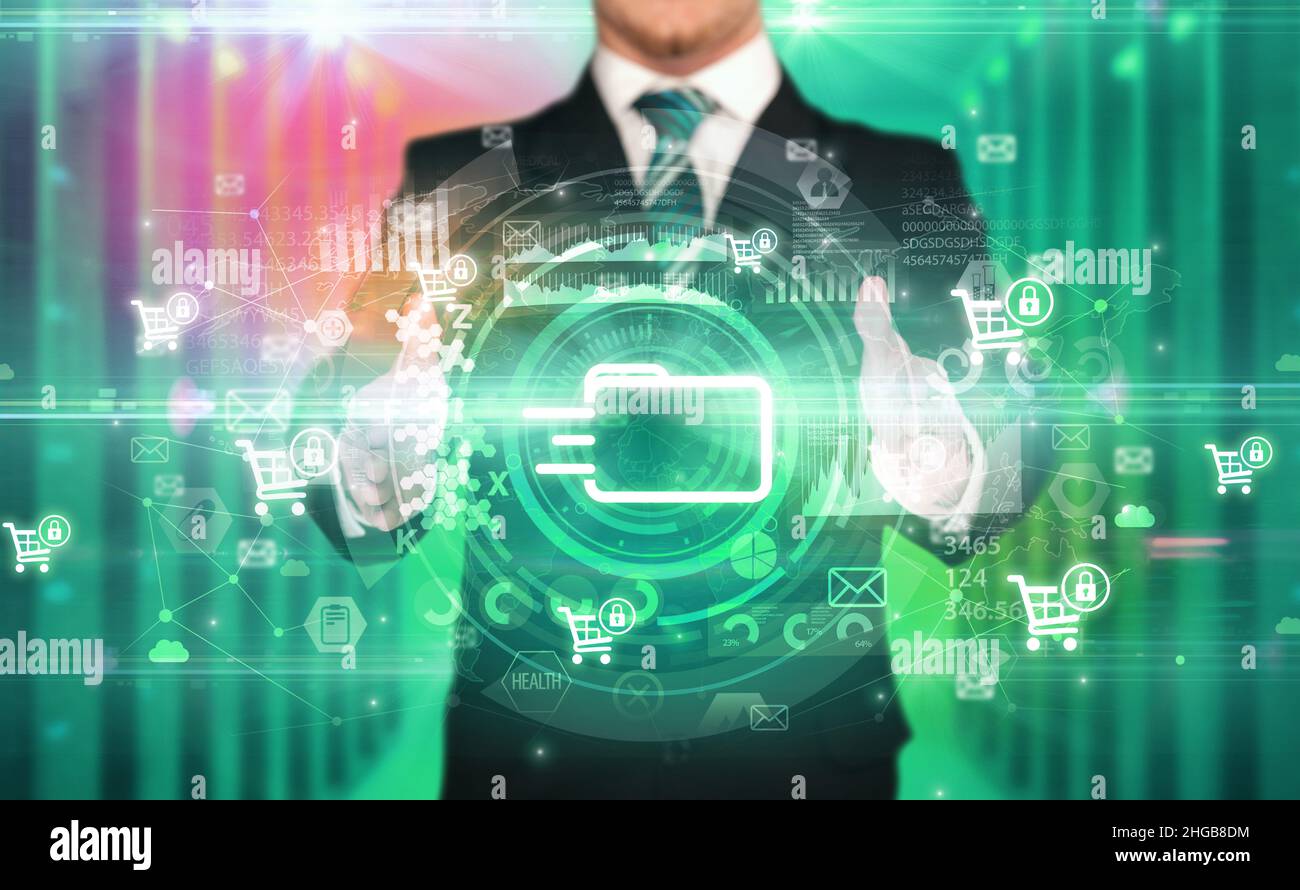 Businessman holding technology icon concept Stock Photo - Alamy