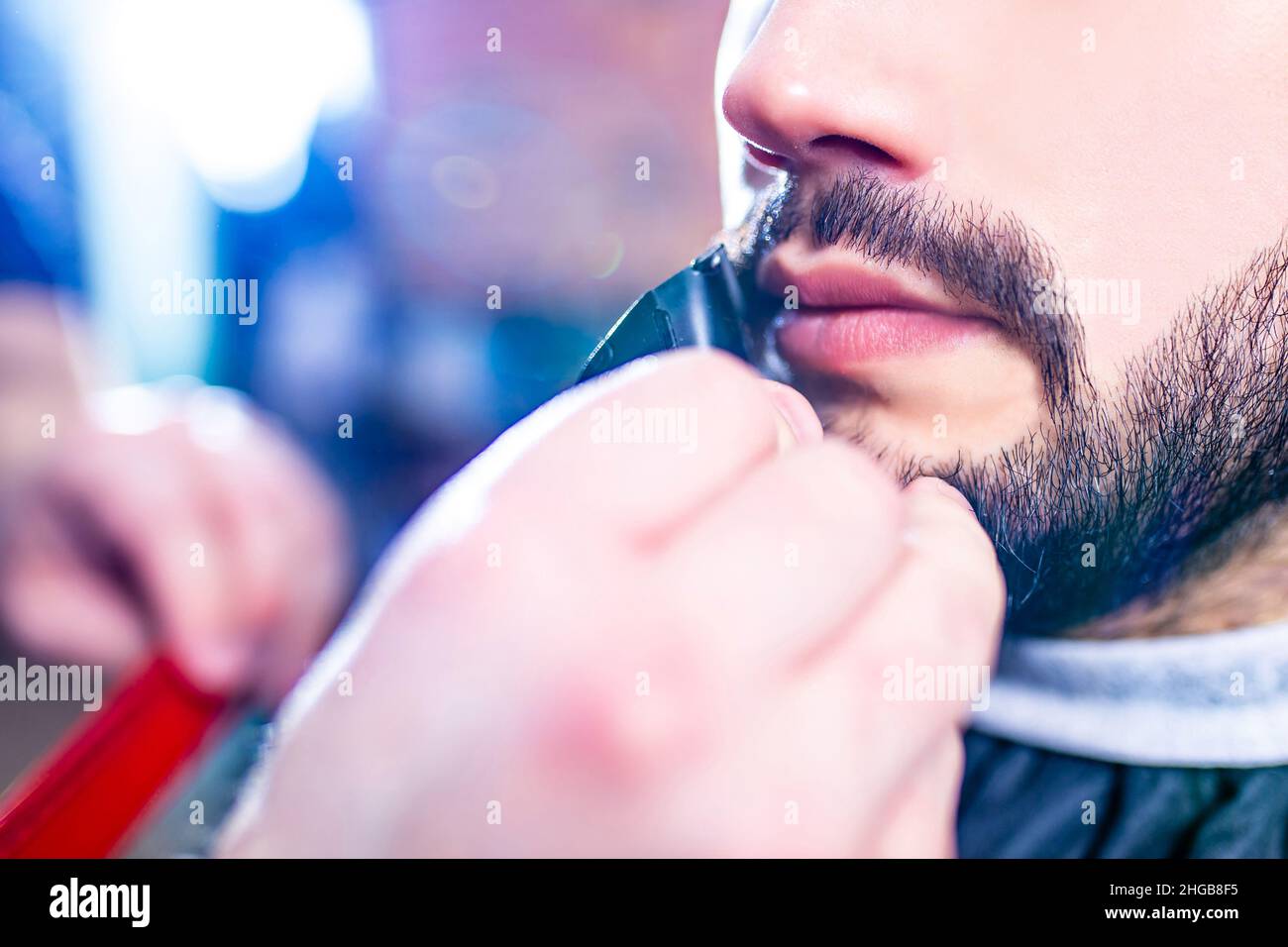 arabic handsome bearded man getting haircut at barbershop Stock Photo ...