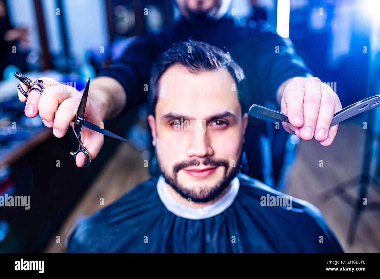 Hairstylist cutting hair of male customer at barber shop Stock Photo ... Hairstylist cutting hair of male customer at barber shop Stock Photo ...