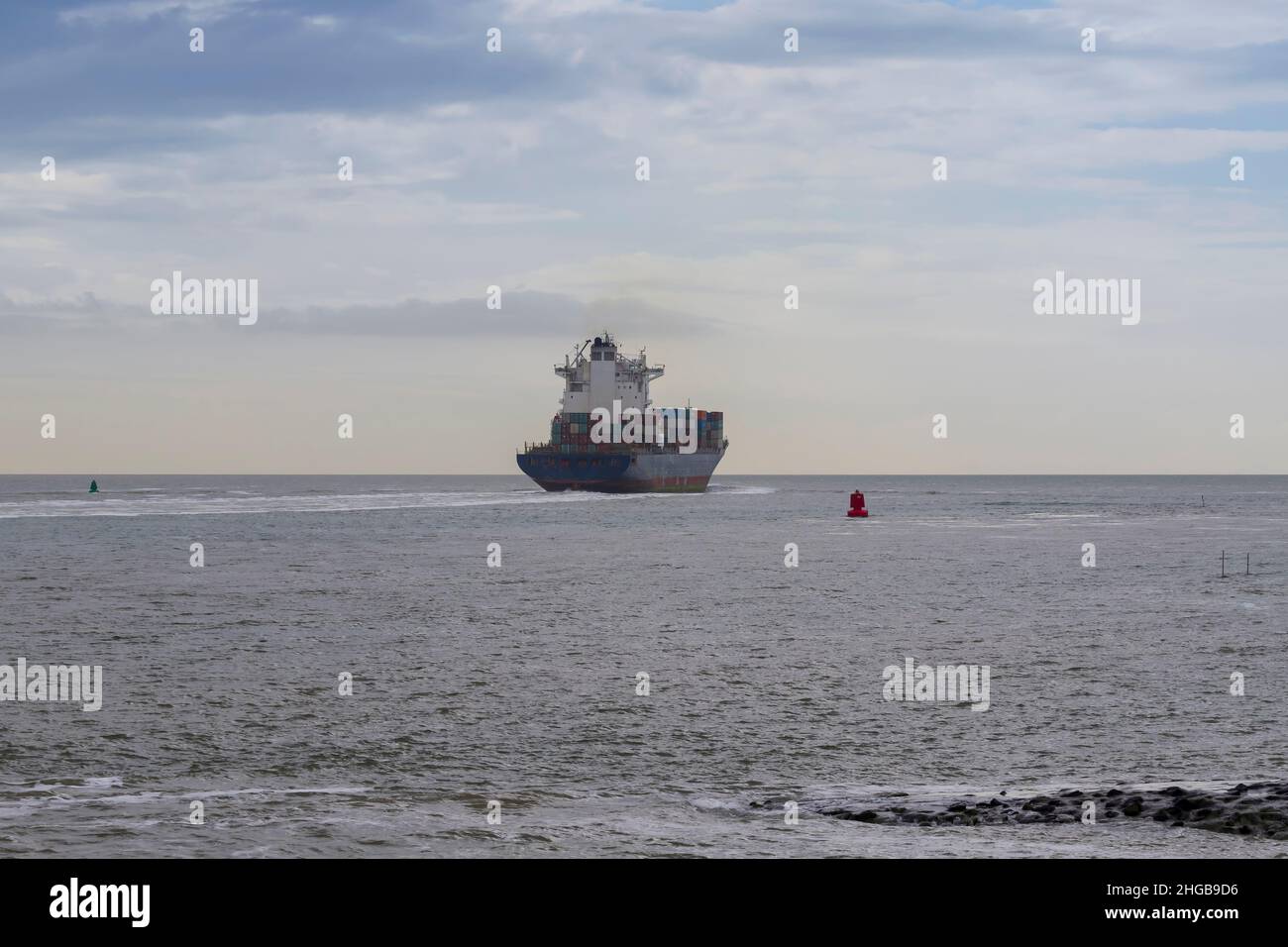 A large transport ship loaded with containers sails across the North ...
