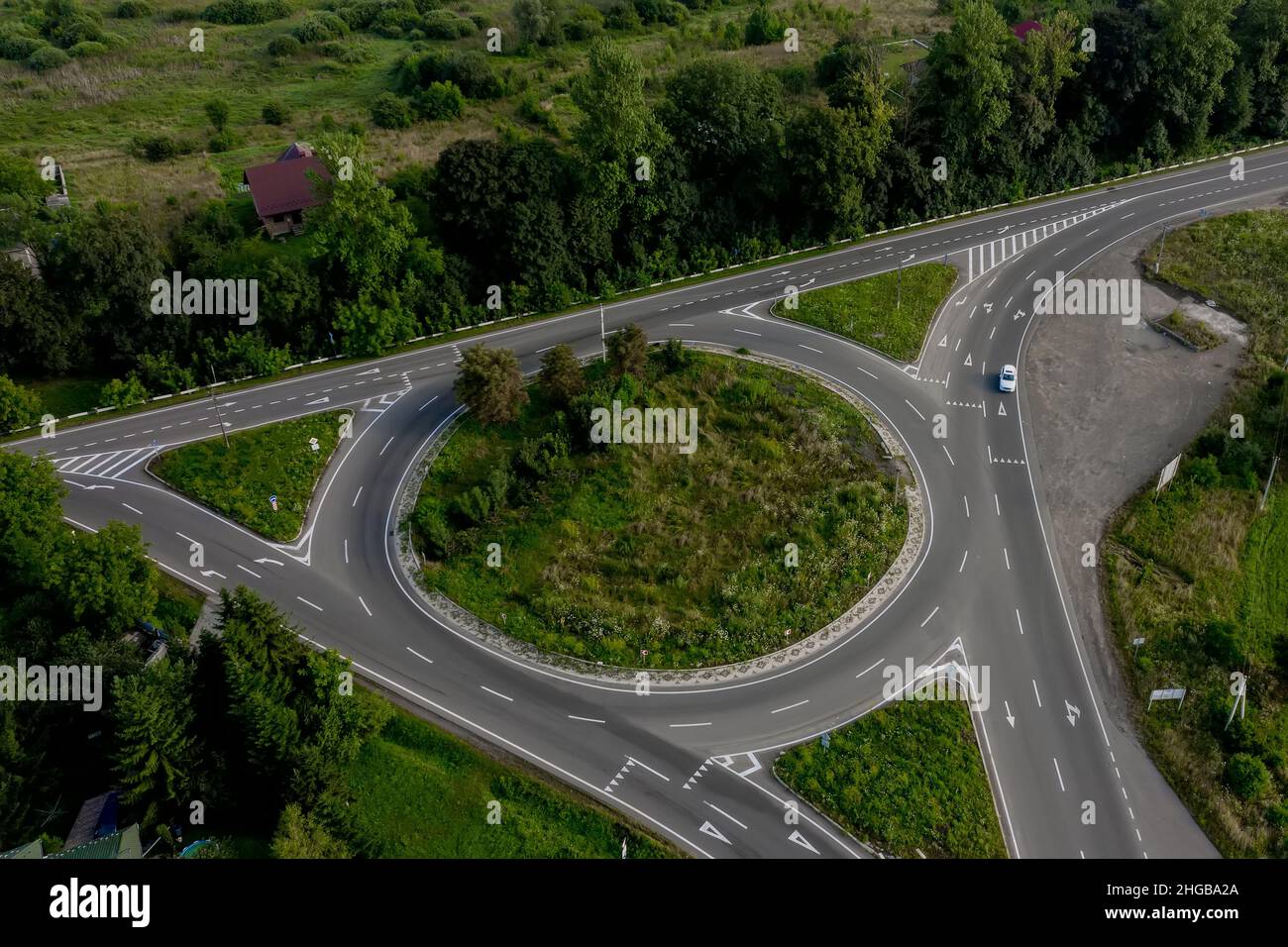 Roundabout traffic of cars and trucks on the circle ring road aerial ...