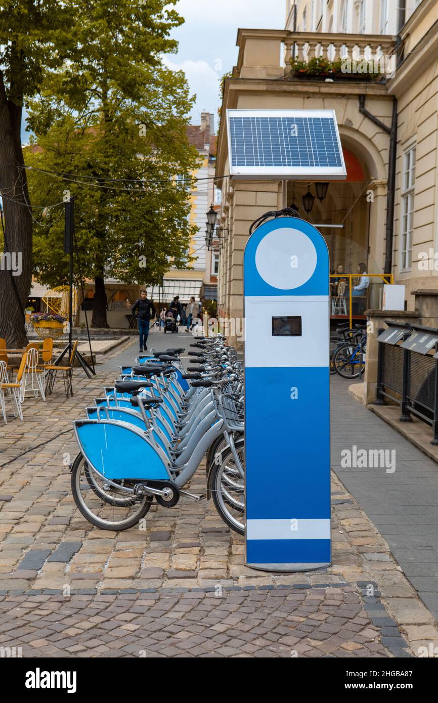 renting bike park at the city center modern transport Stock Photo - Alamy