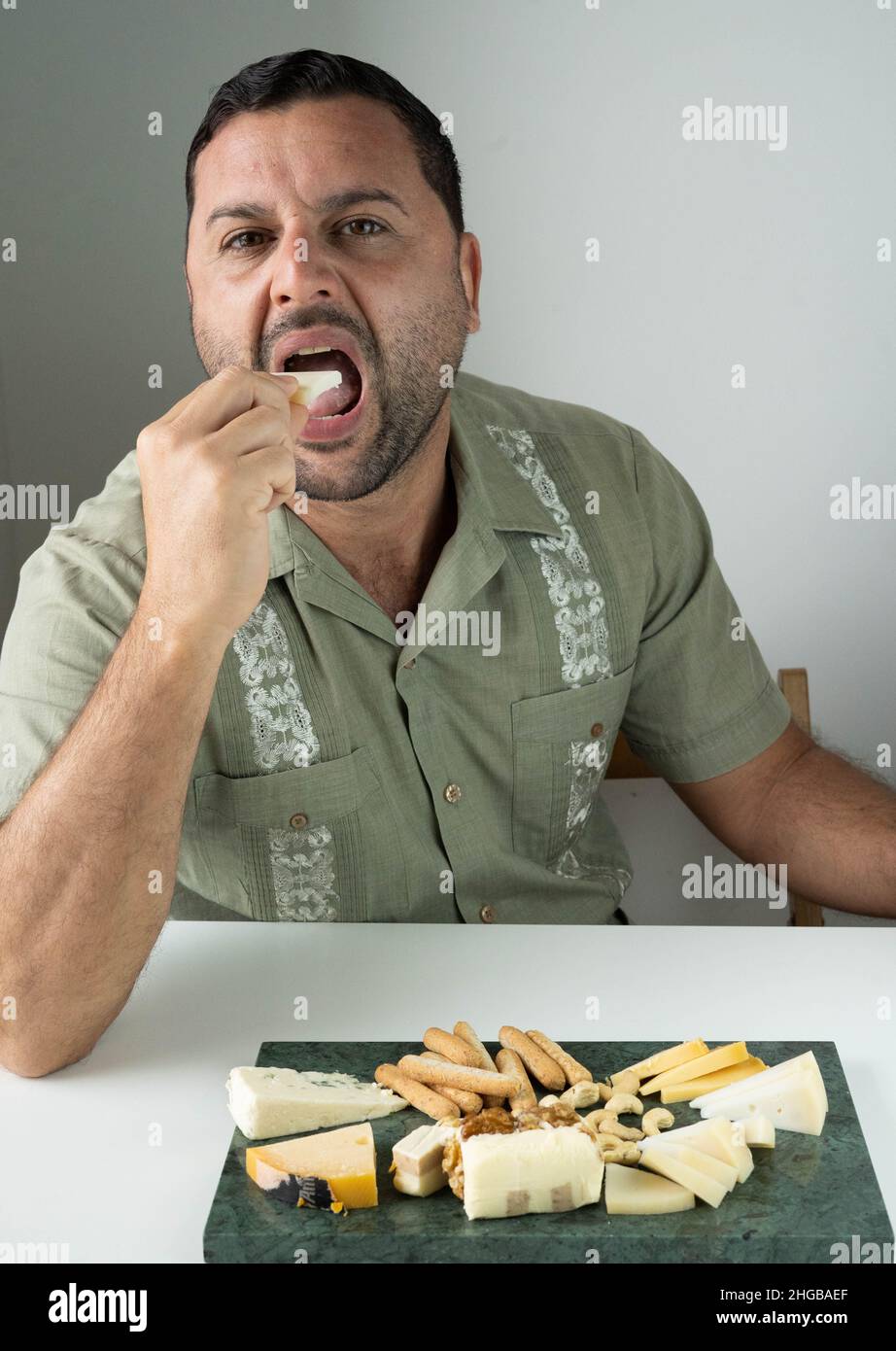Man slice fresh milk product cheese hi-res stock photography and images ...