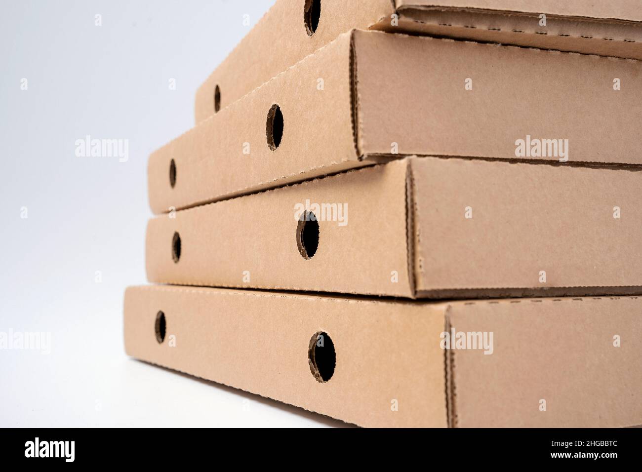 Stack flat brown cardboard pizza boxes on a white background Stock ...
