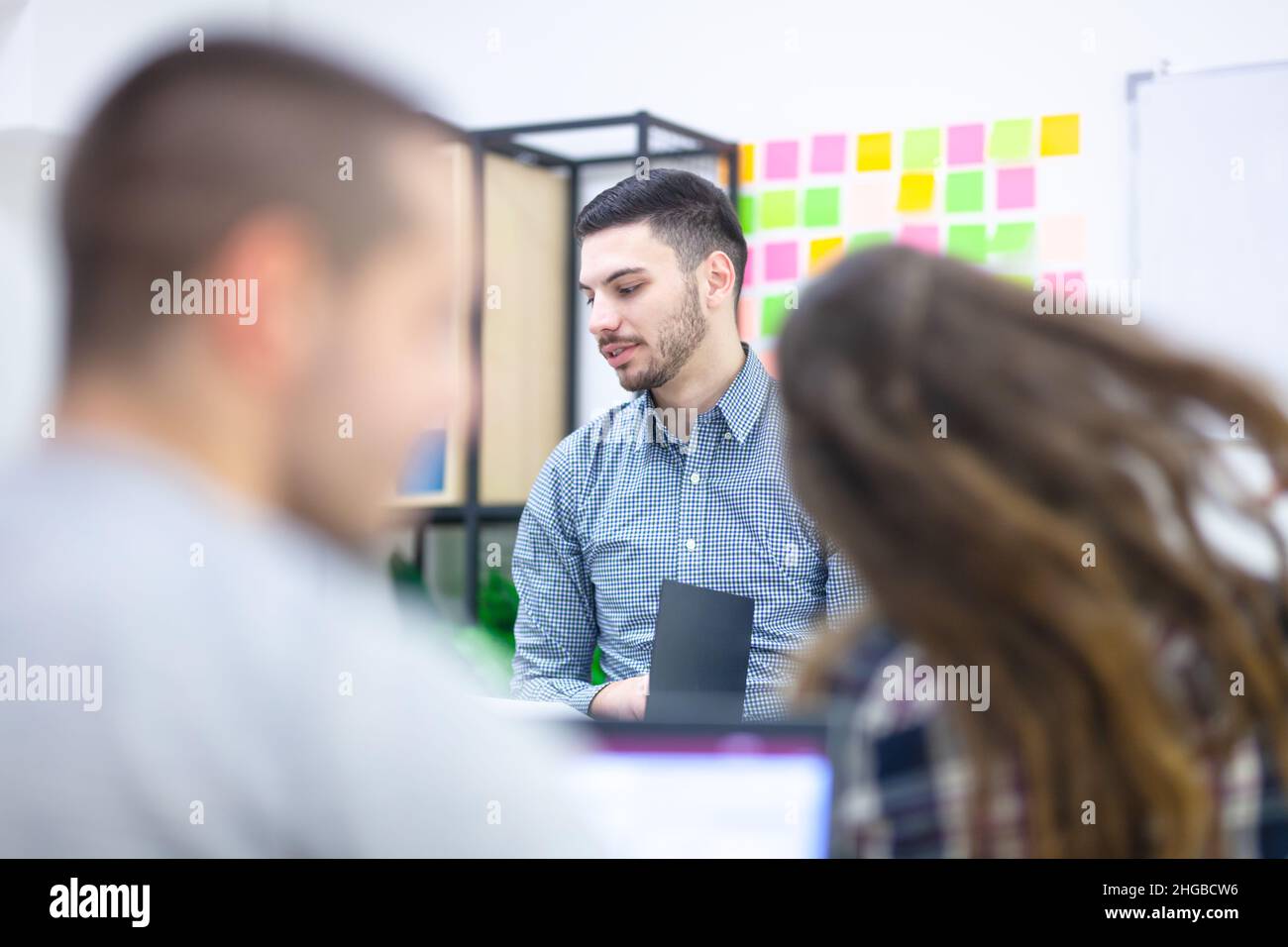 professor talking to students in a modern classroom Stock Photo - Alamy