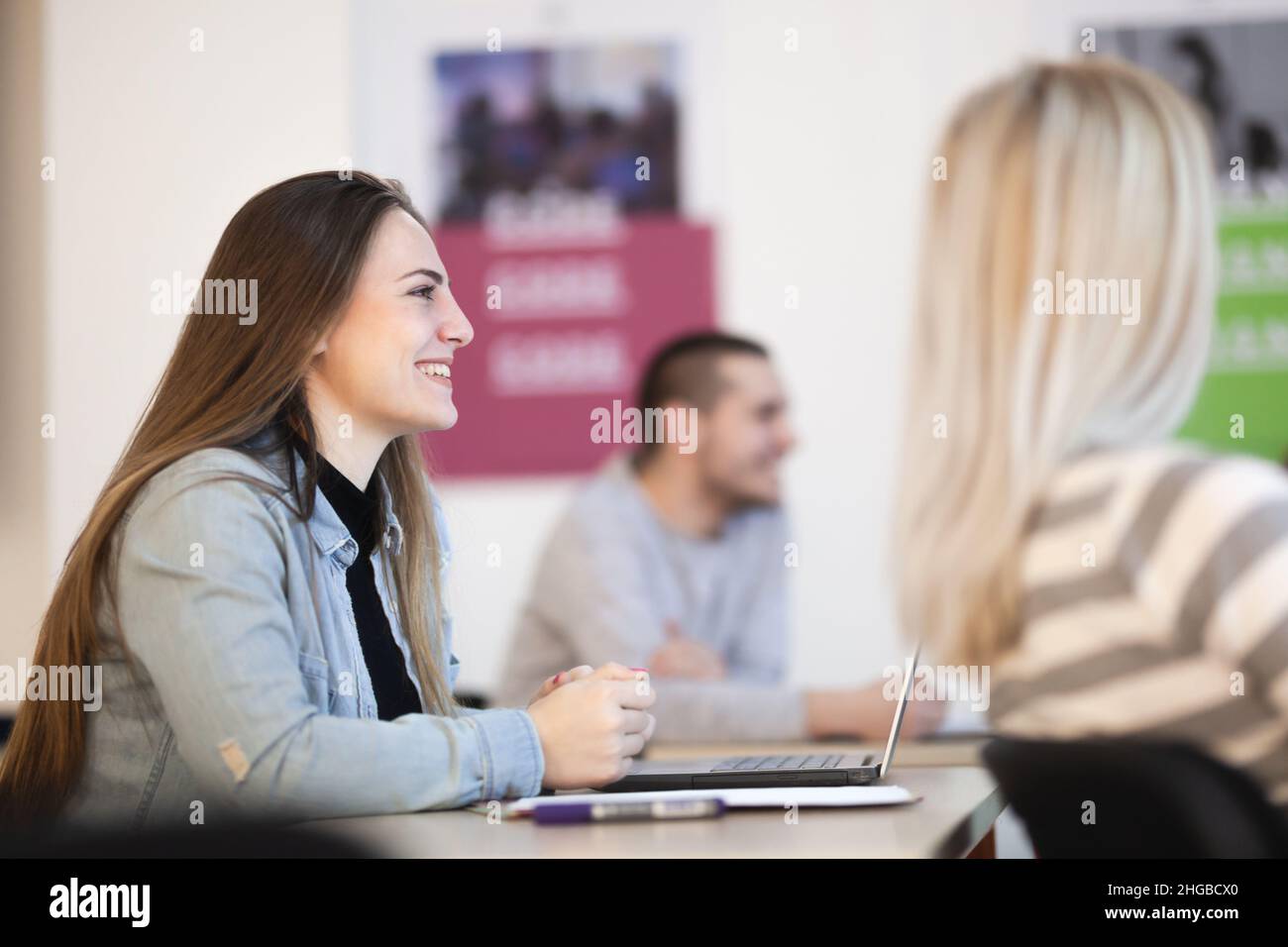 Young student in modern classroom listening to lecture Stock Photo - Alamy