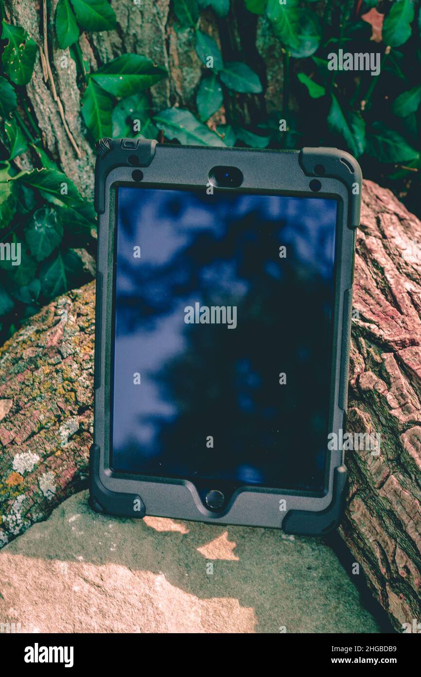 Handheld tablet out in nature Stock Photo - Alamy