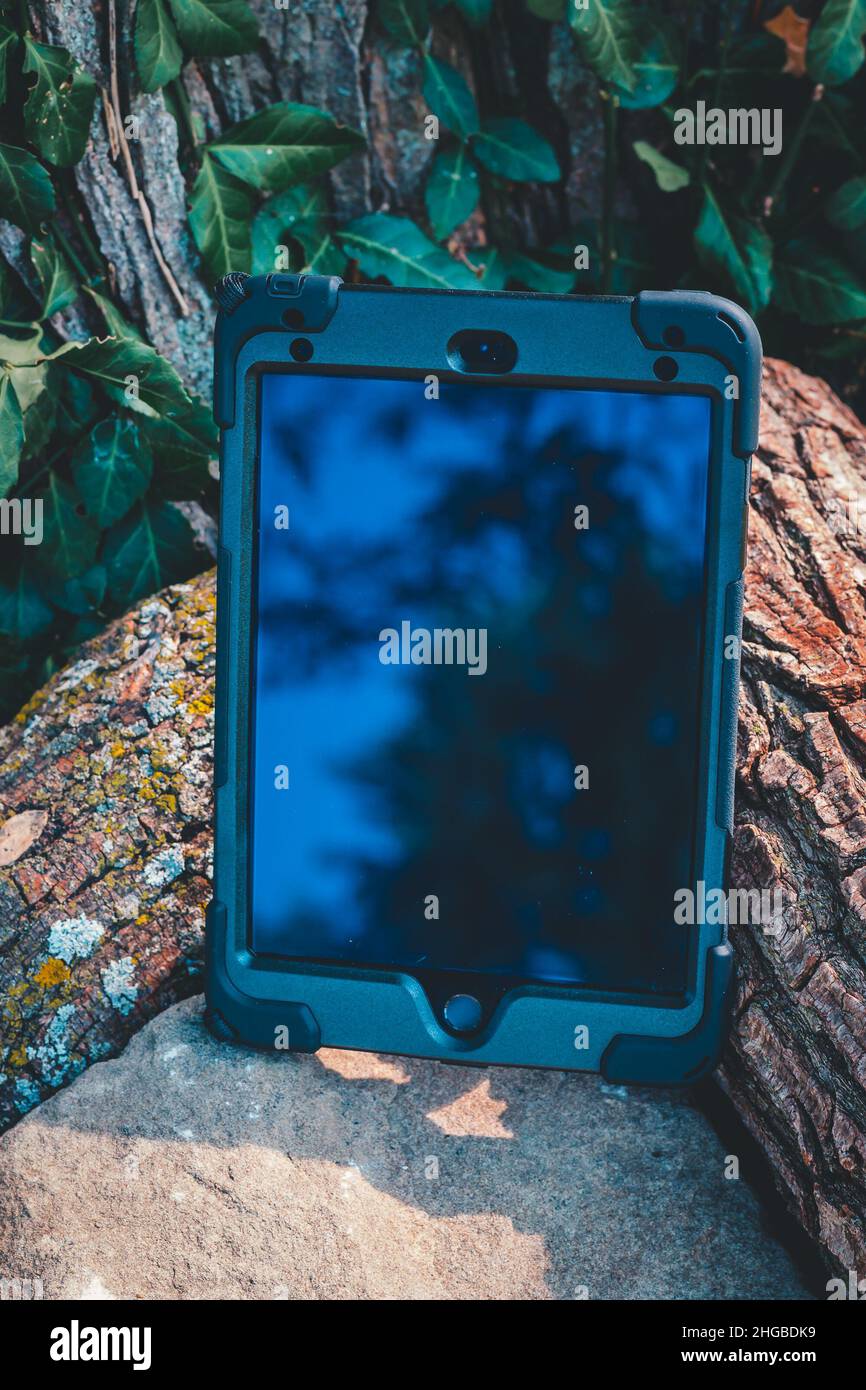 Tablet out in nature Stock Photo - Alamy