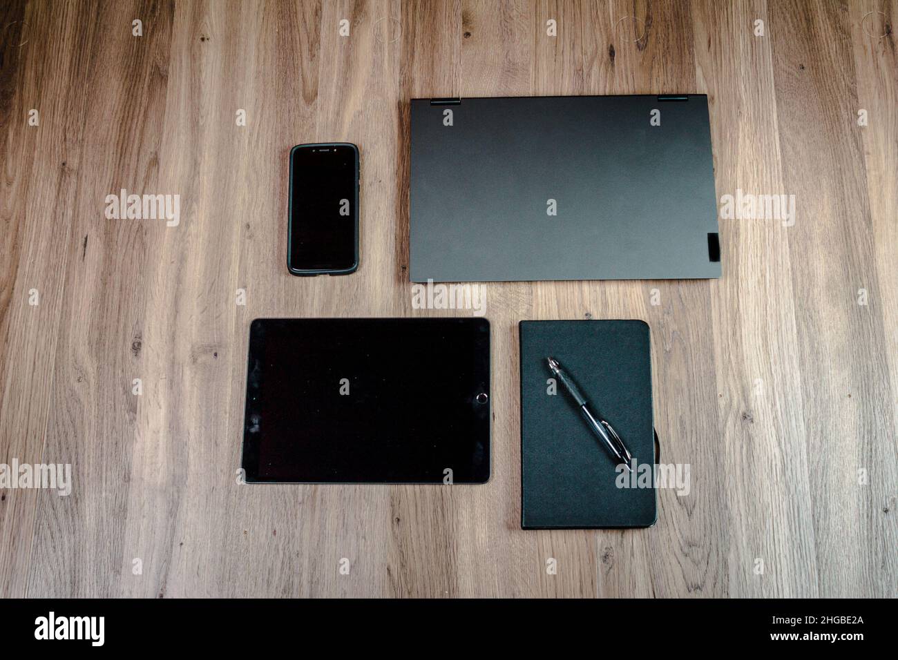 Flat lay of office technology on a desk Stock Photo - Alamy