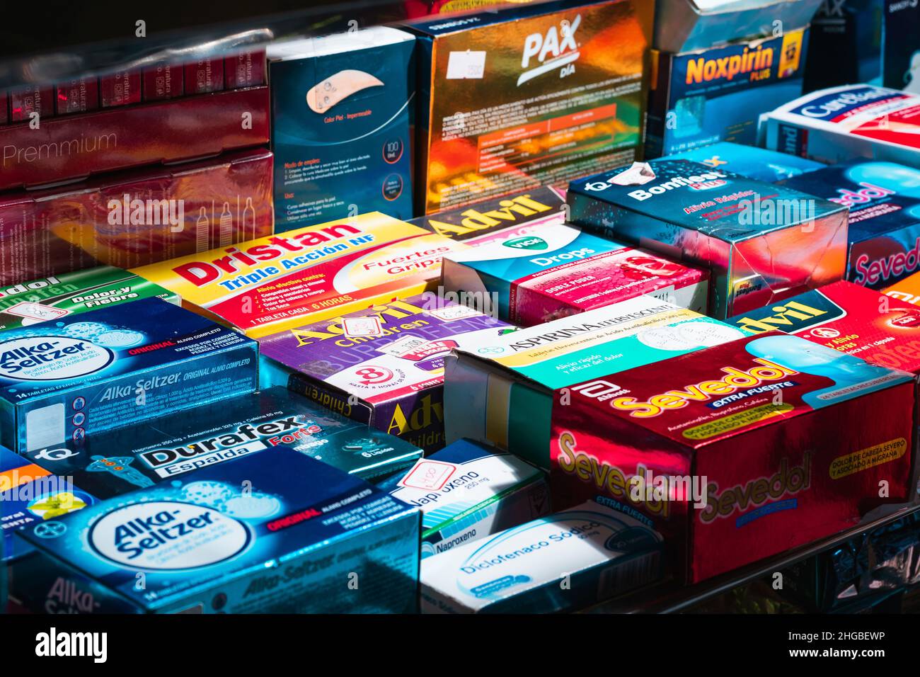 Drugstore display case with boxes of pills such as: Dristan, Advil ...