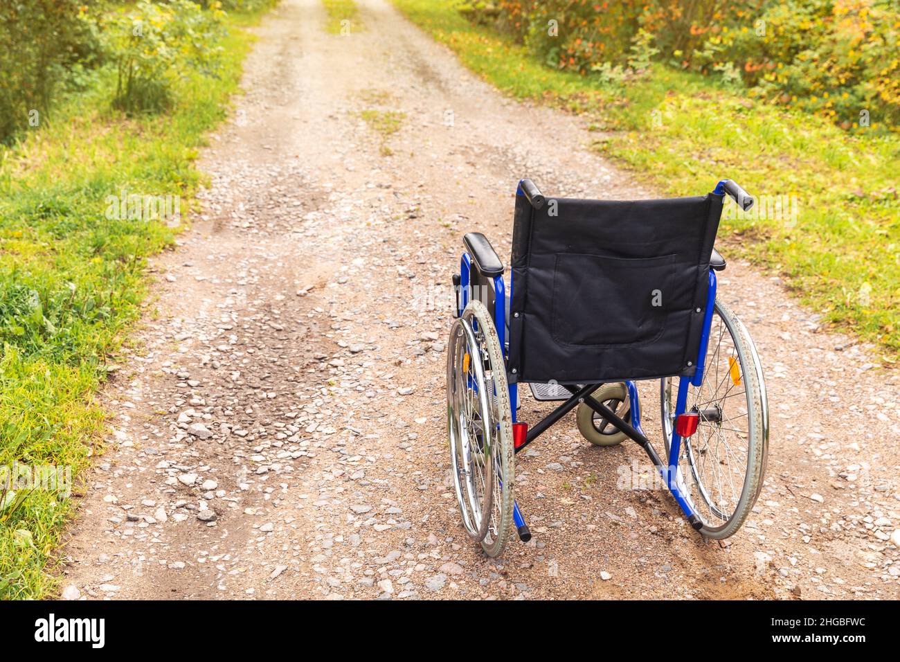 Empty wheelchair standing on road waiting for patient services. Wheel ...