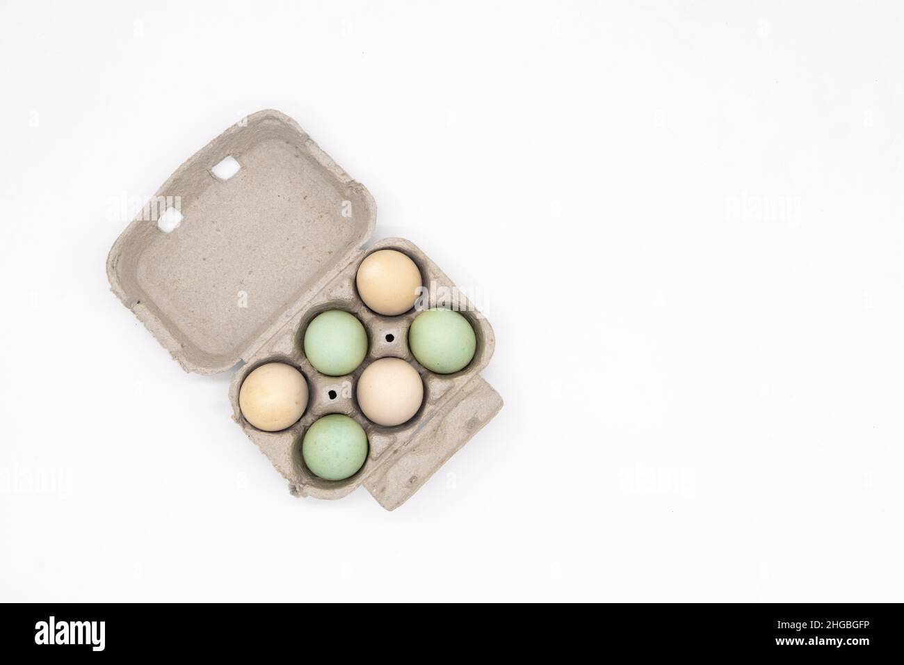 cardboard box of 6 colourful free range farm eggs blue green and brown ...