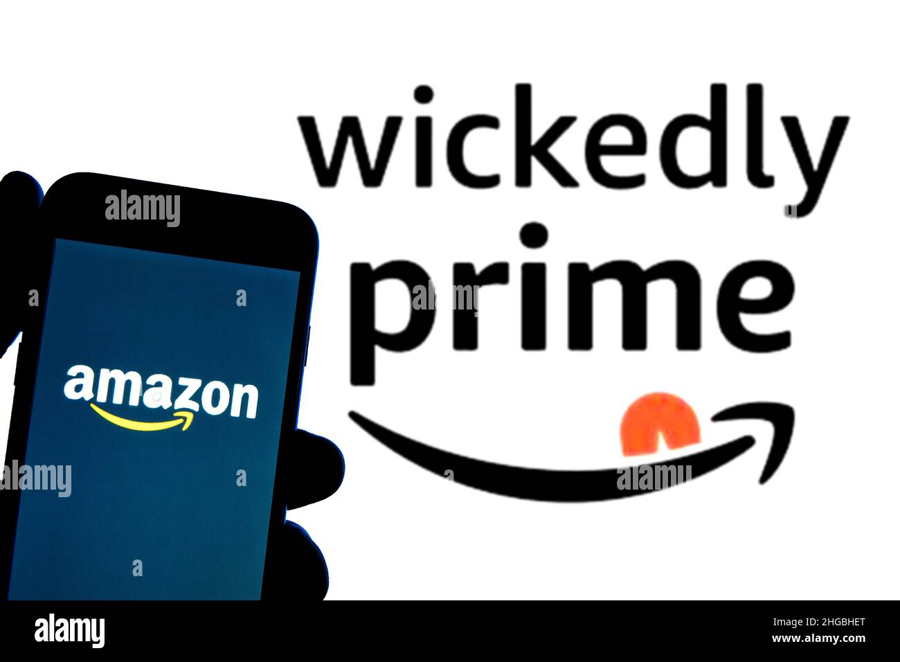 In this photo illustration an Amazon logo seen displayed on a ...