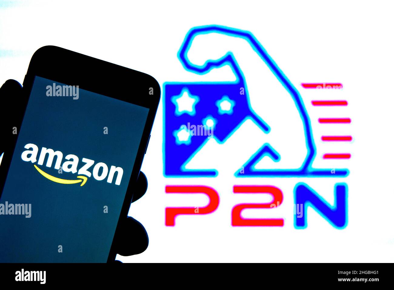 Spain. 12th Jan, 2022. In this photo illustration an Amazon logo seen ...