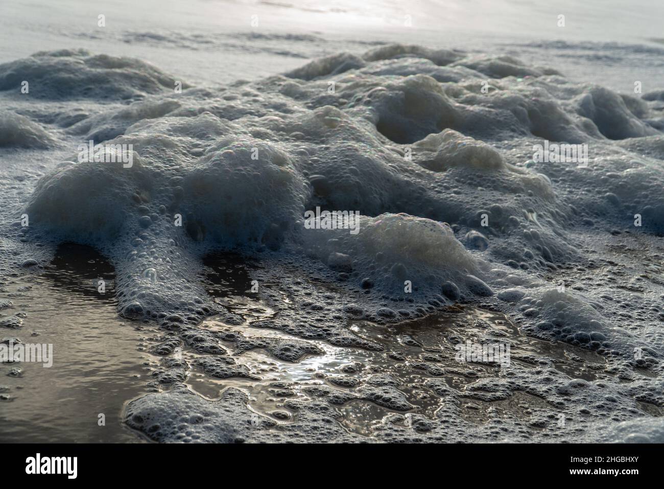 Sea Foam On Beach Stock Photo - Alamy