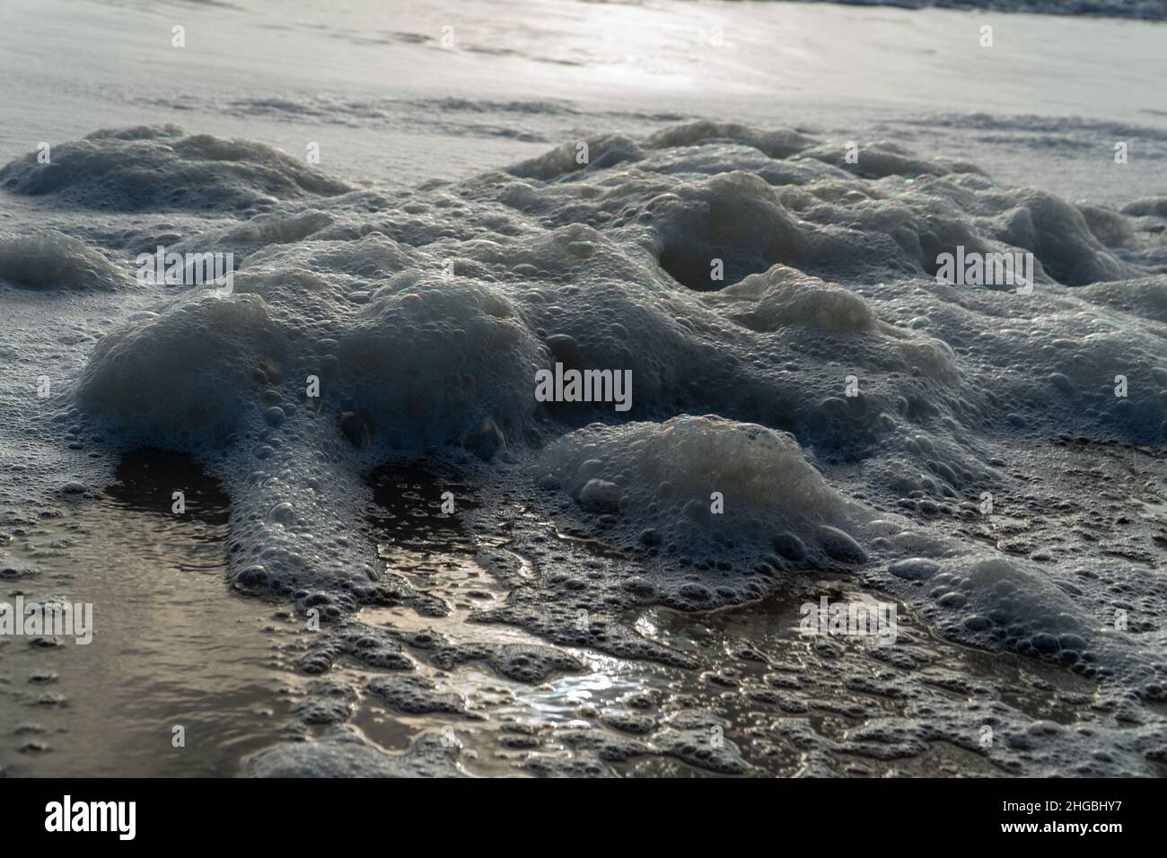 Sea Foam On Beach Stock Photo - Alamy