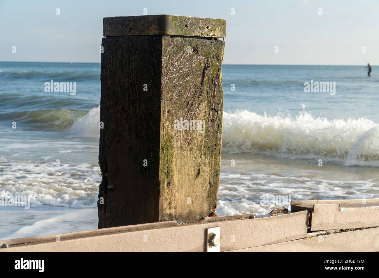 Wooden Groin With Waves Breaking Stock Photo - Alamy