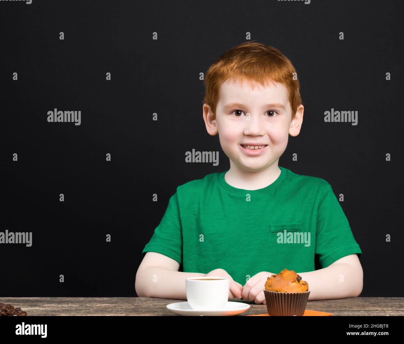 a red-haired boy with a beautiful face is drinking tea, coffee beans ...
